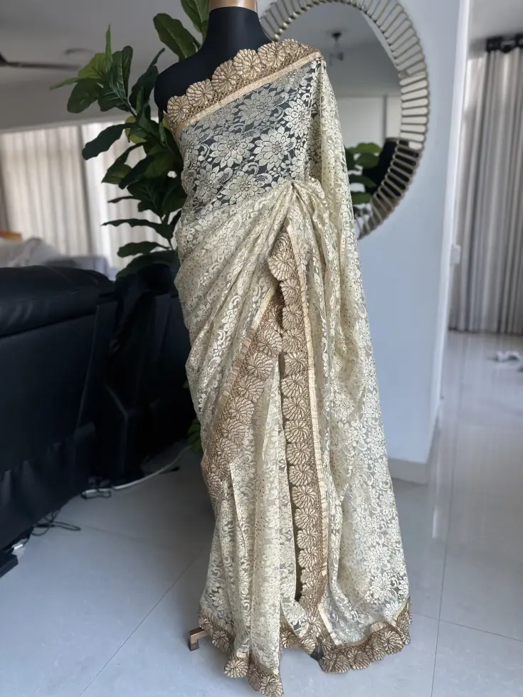 Cream chantilly lace saree with intricate gold border - houseofsareebd